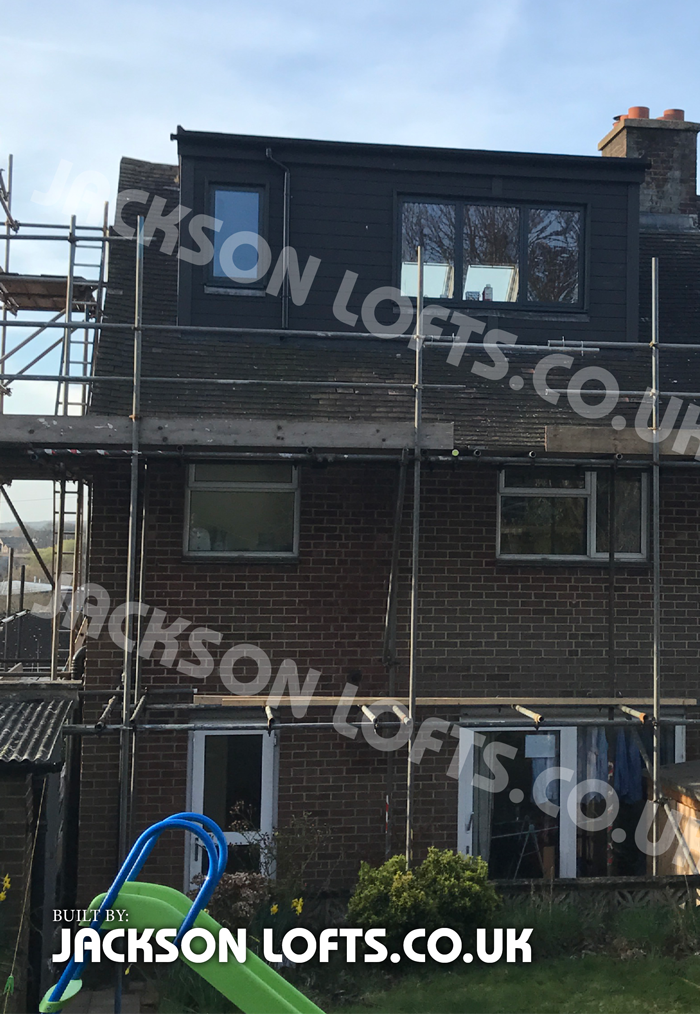 Smart black recycled plastic cladding on dormer loft conversion Sussex ...